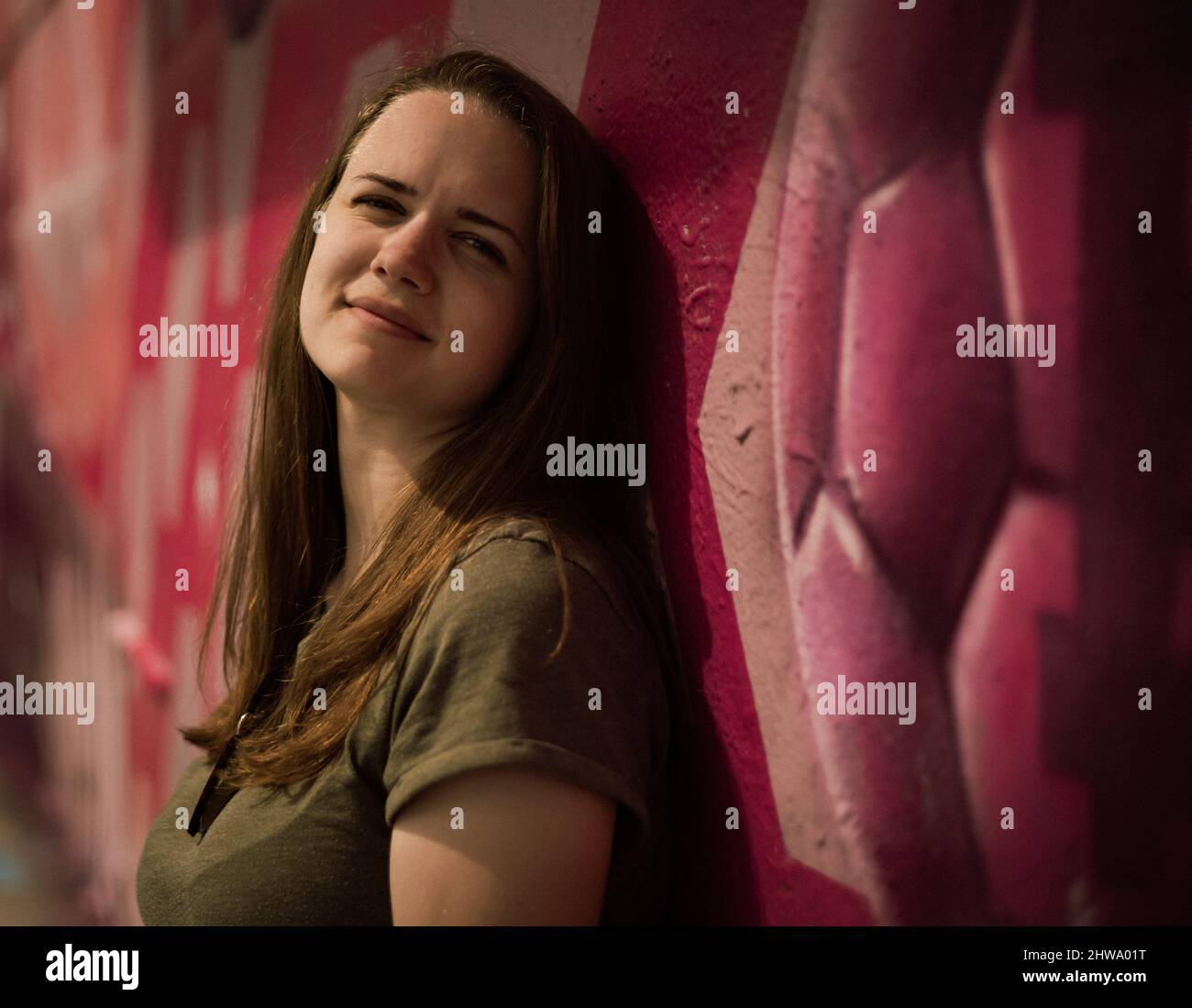 Street style photo shoot with a young pretty woman in the colorful ...