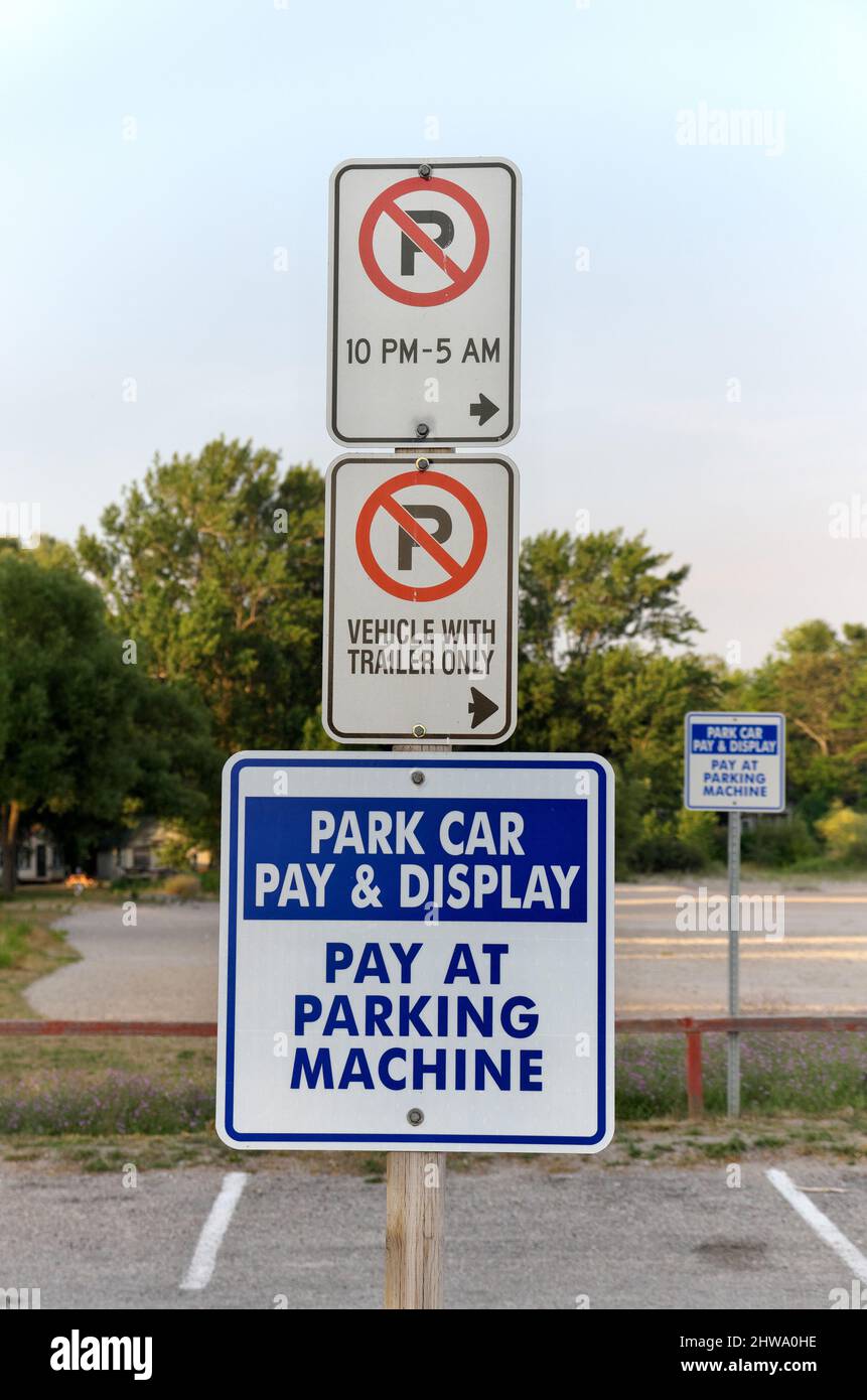 Pay and Display Parking Signs at a Beach Parking Lot Stock Photo - Alamy