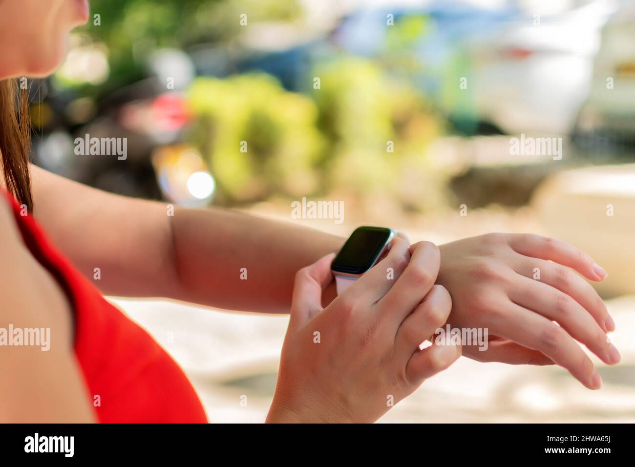 Shallow focus of a young fitness girl checking her smart watch Stock ...