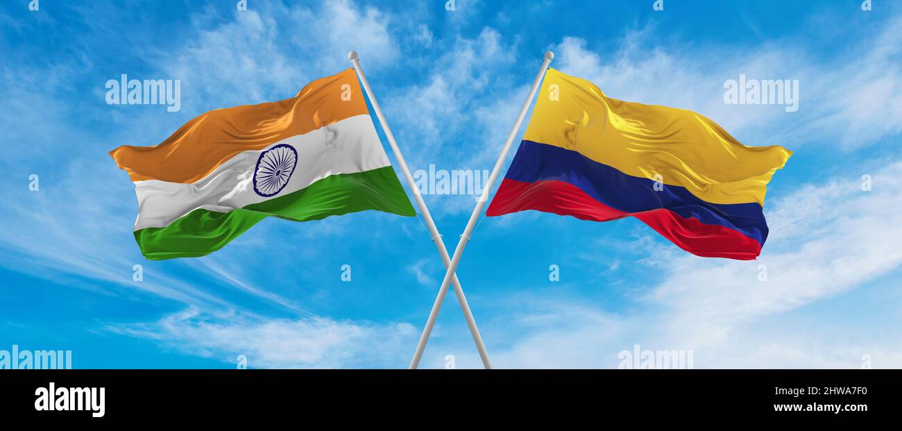 crossed national flags of India and Colombia flag waving in the wind at ...