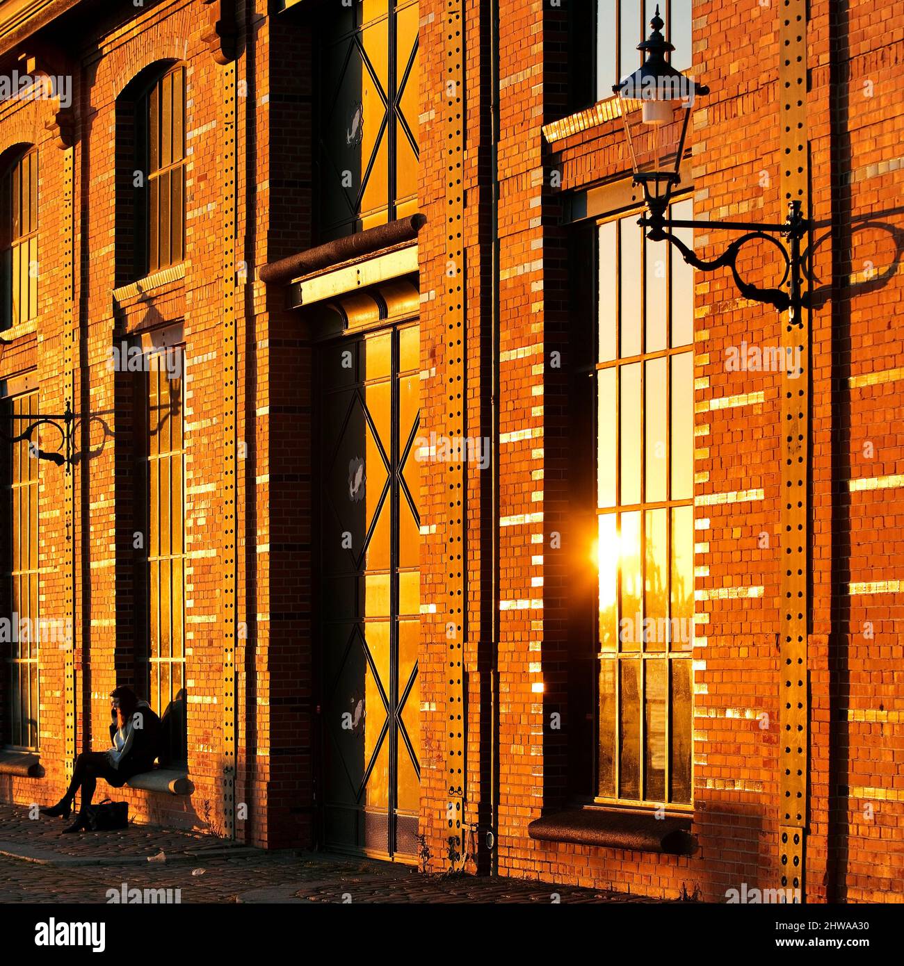Shore side cladding of the fish auction house Hamburg-Altona at sunset ...