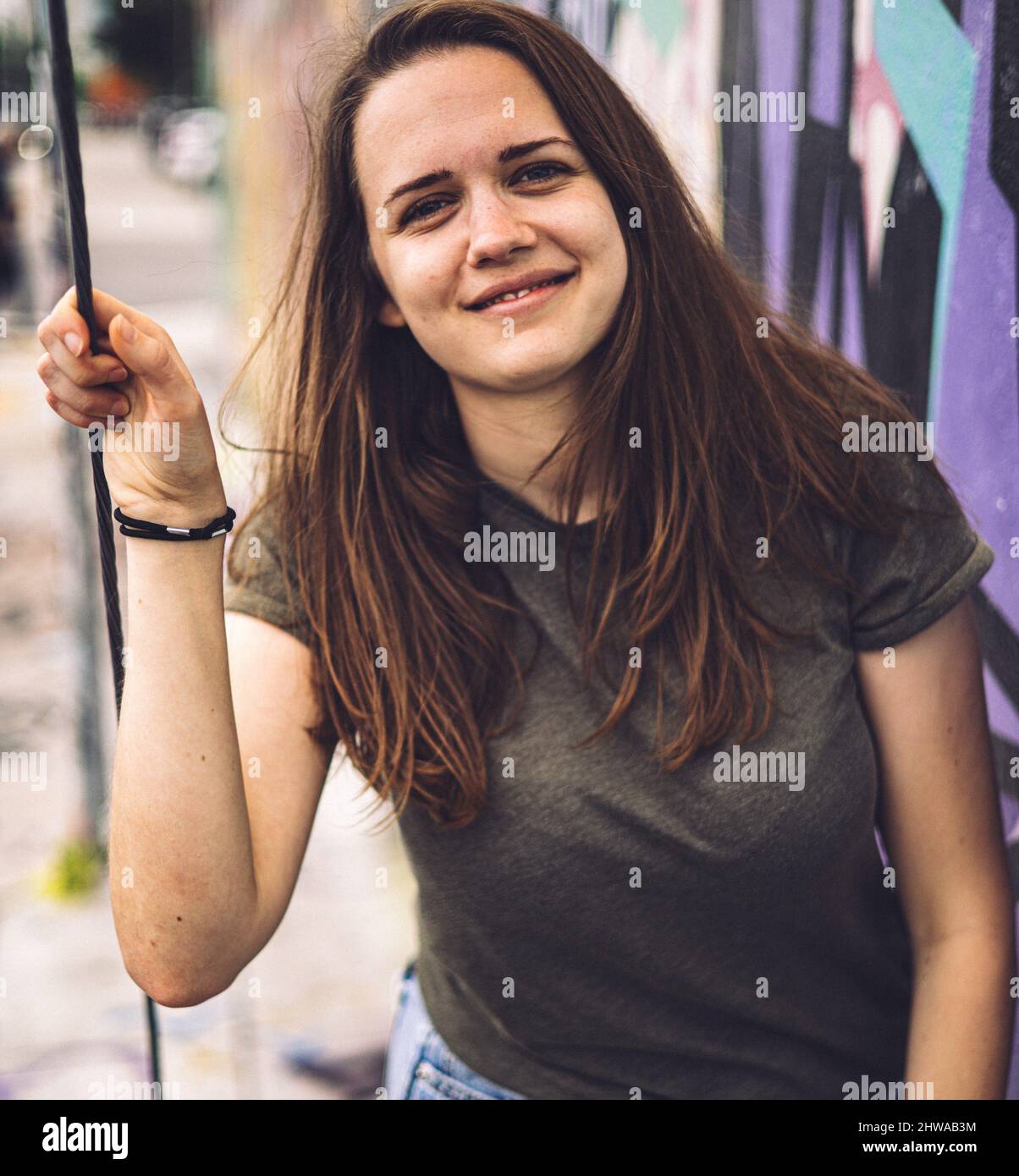 Happy girl smiles at the camera at photoshoot in the streets of Miami ...