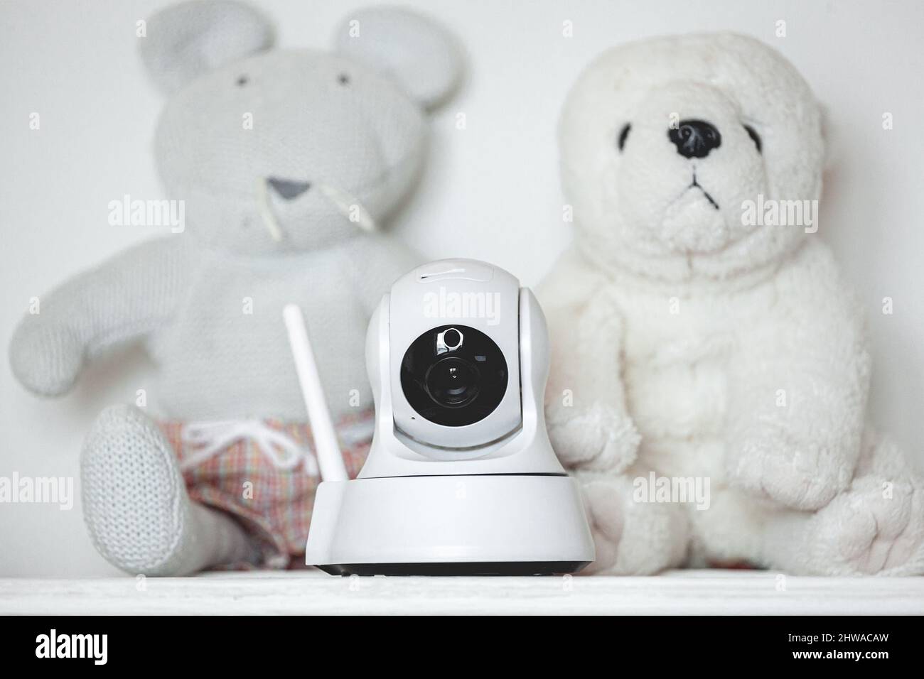 IP camera on the shelf with toys, serving as baby monitor Stock Photo ...