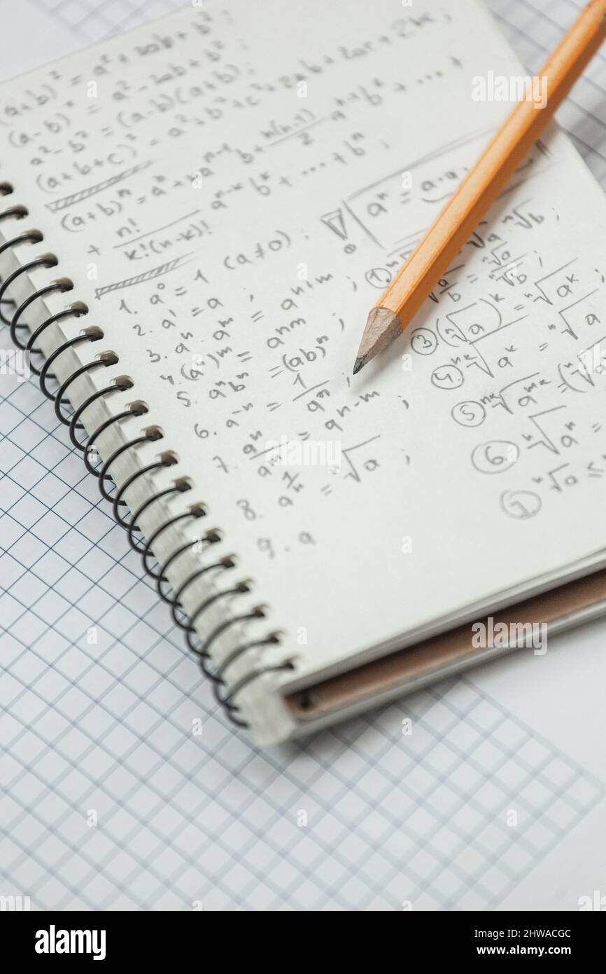 Math formulas are written in pencil on a piece of paper, math pr Stock ...