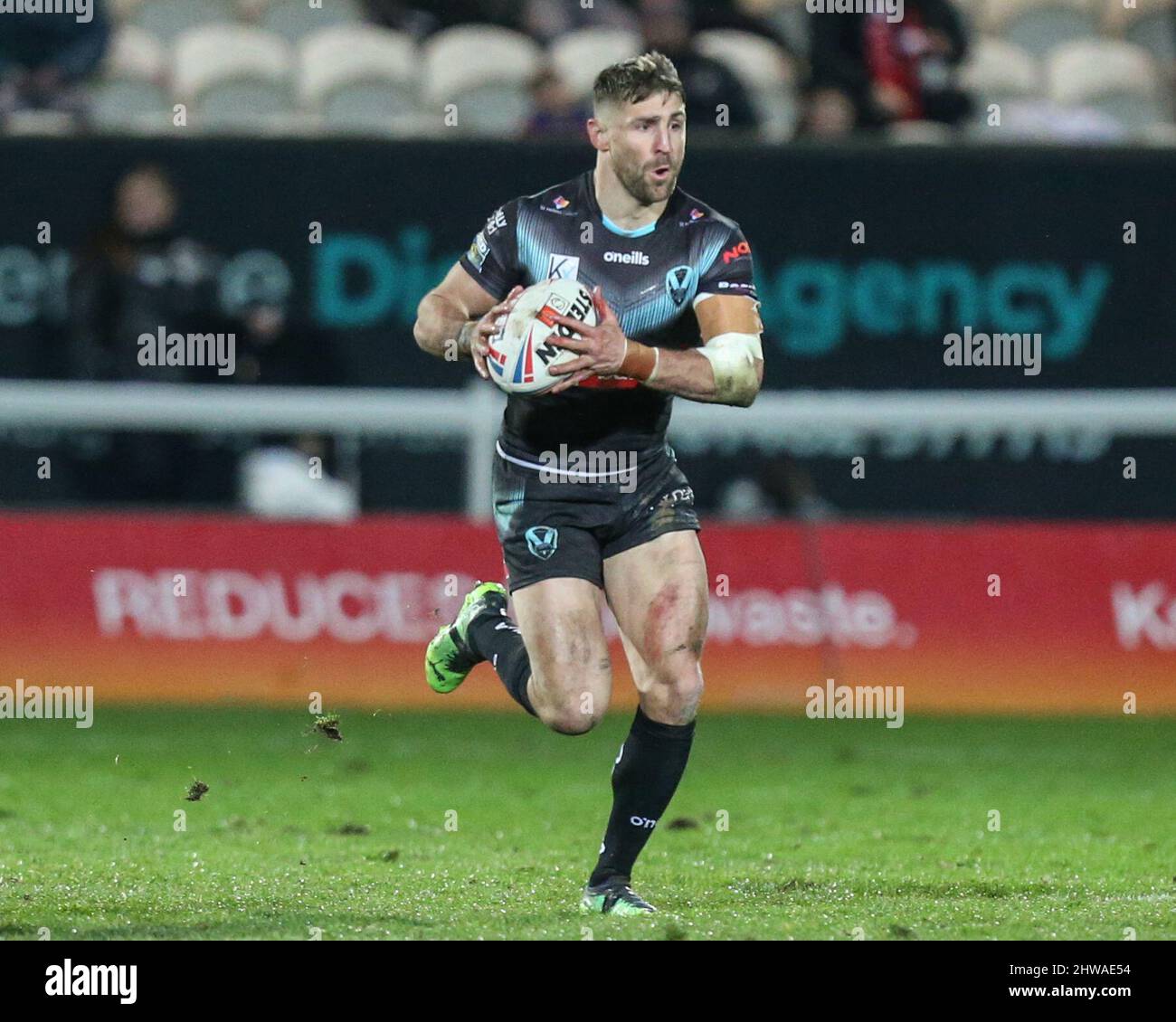 Tommy Makinson (2) of St Helens in action during the game Stock Photo ...