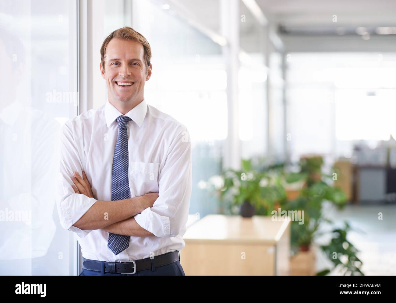 Success is not random. Portrait of a handsome businessman leaning ...