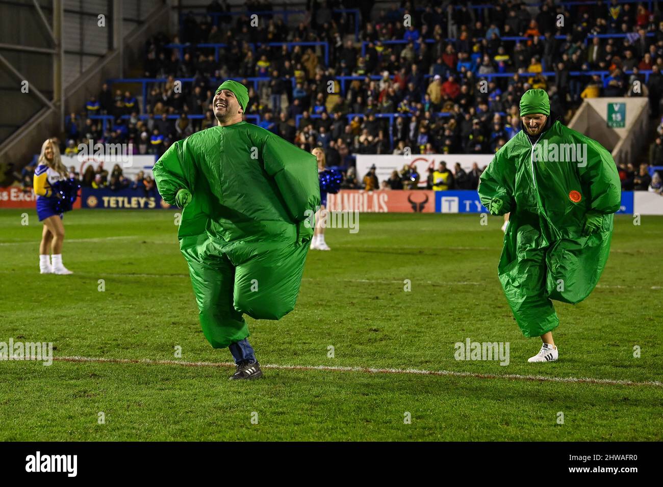 The green man running challenge at Half Time at The Halliwell Jones ...