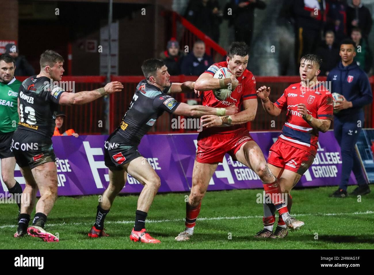 Sam Wood #24 of Hull KR runs at the St Helens defence Stock Photo - Alamy
