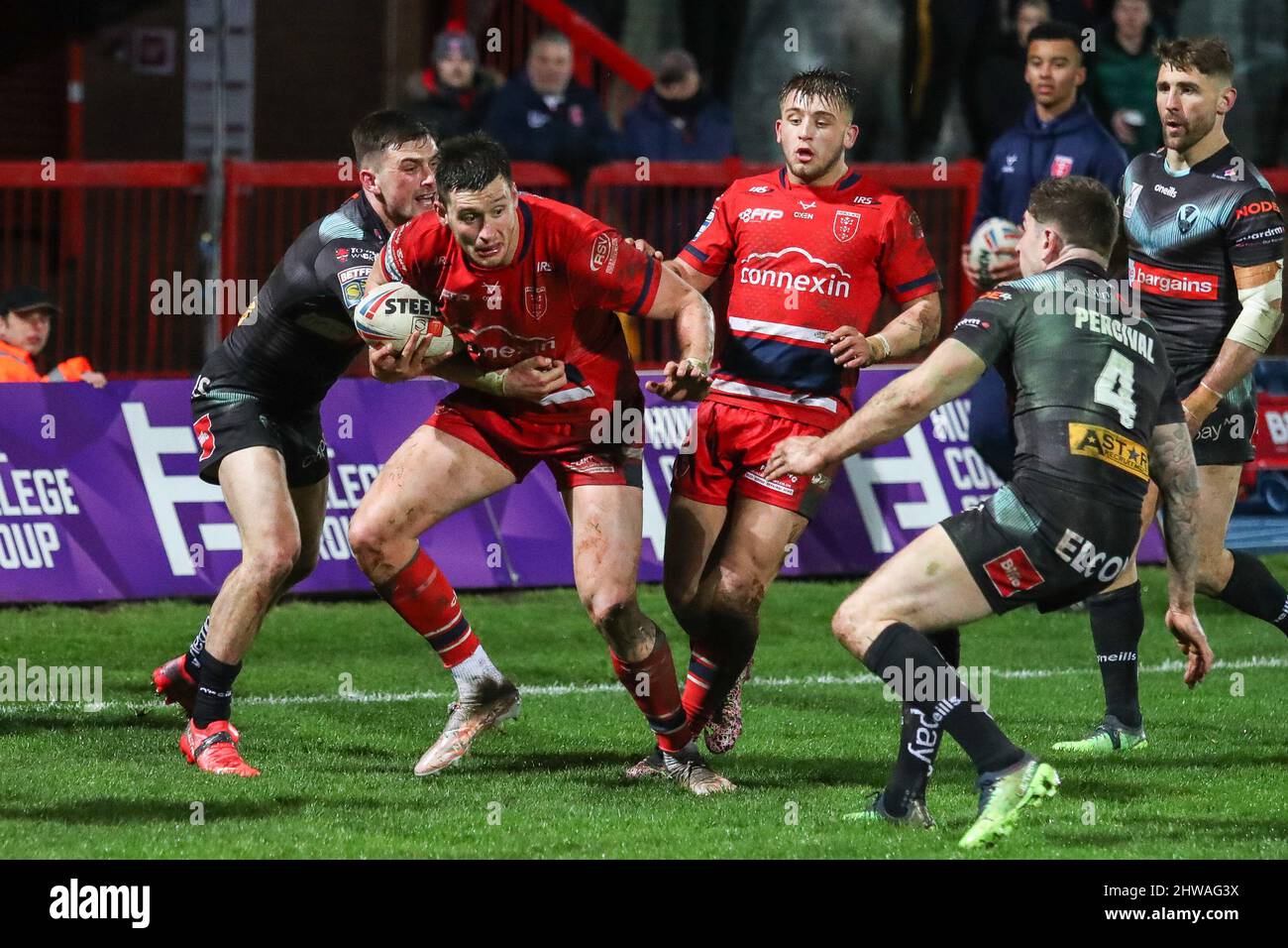 Sam Wood #24 of Hull KR runs at the St Helens defence Stock Photo - Alamy