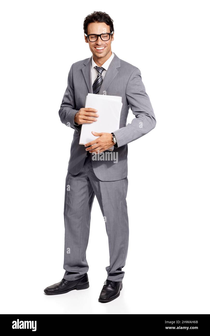 Proud of his work. Full body of a handsome young executive carrying his ...