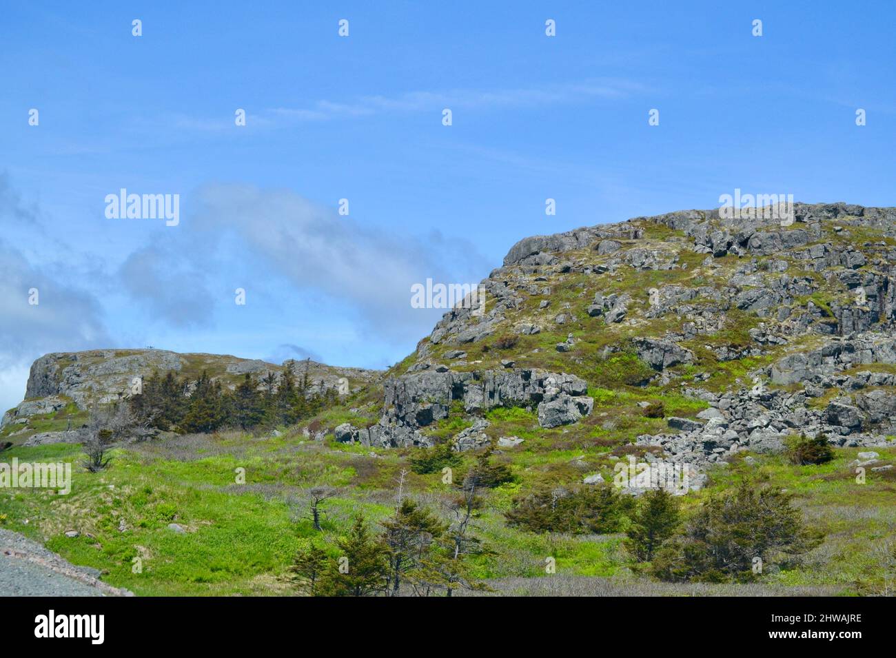 Flat topped bedrock hills along Newfoundland highway during Spring ...