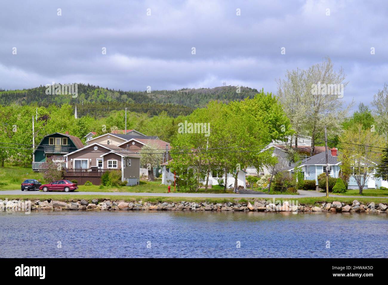 Homes along water with scenic landscape on the horizon along ...