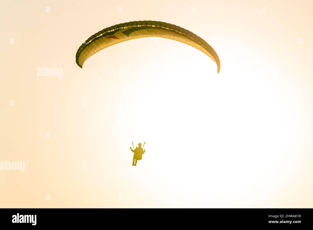 Paragliding concept, Silhouette of Paraglider on the sky and sun Stock ...