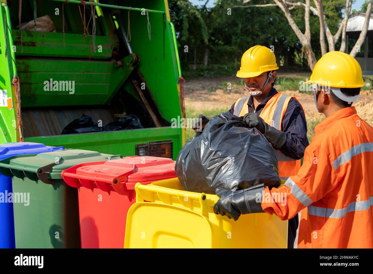 Asian worker collecting garbage of urban municipal are collecting for ...