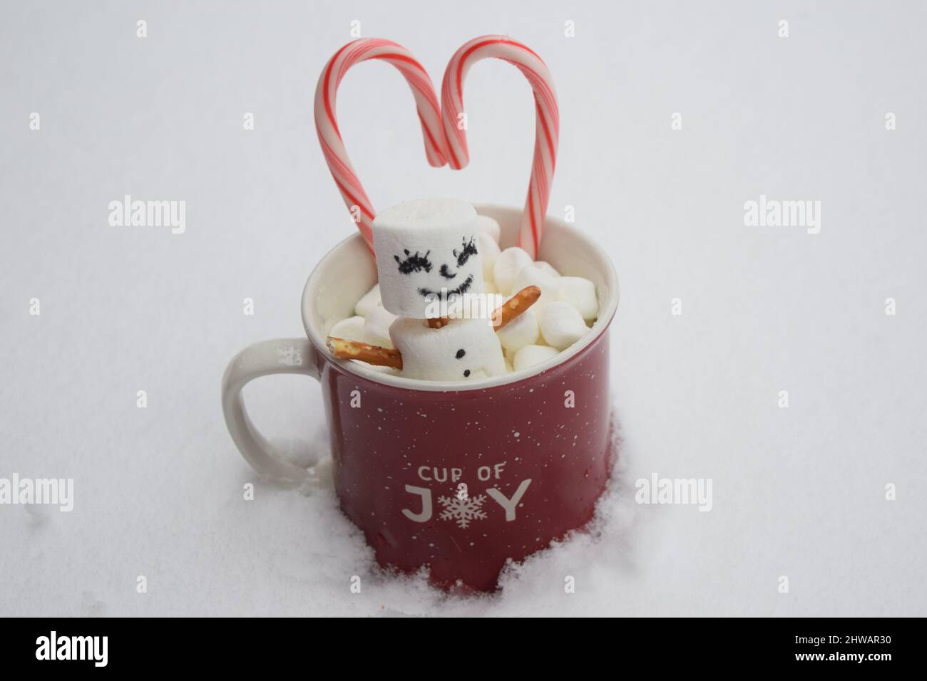 Happy marshmallow person inside red cup that says "cup of joy" with ...