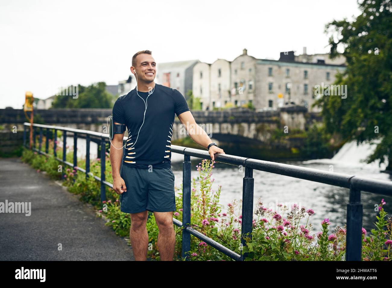 Running with a magnificent view. Shot of a sporty young man taking a ...