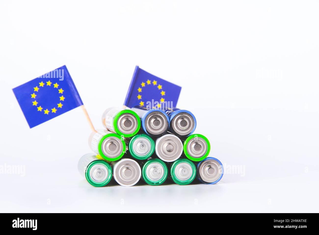 Battery. AA lot of batteries on the background of the flag of the ...
