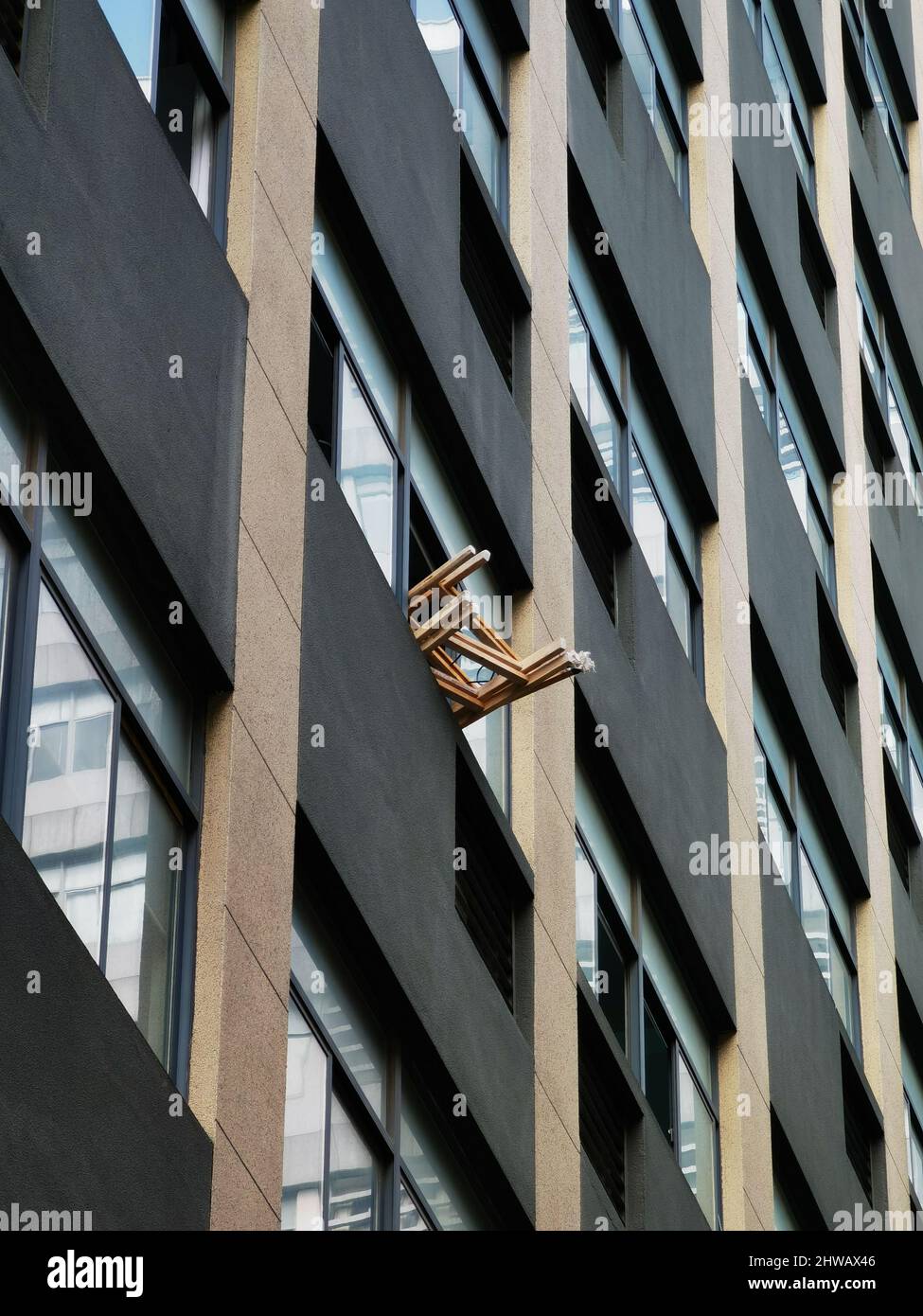 Vertical shot of glass building with wooden stairs out of window Stock ...