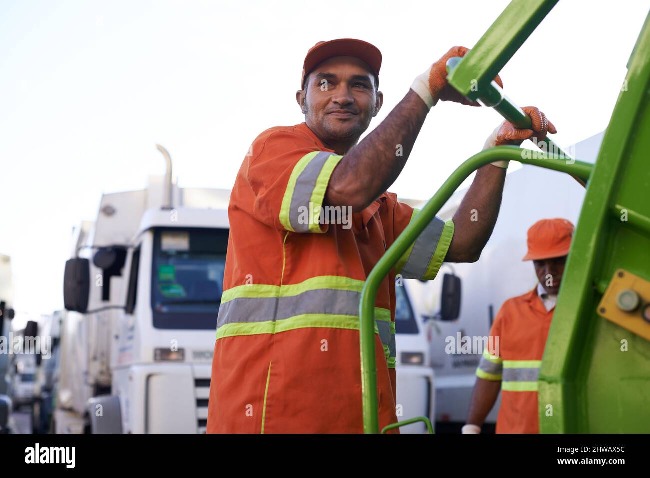 Garbage collectors outside of a building hi-res stock photography and ...