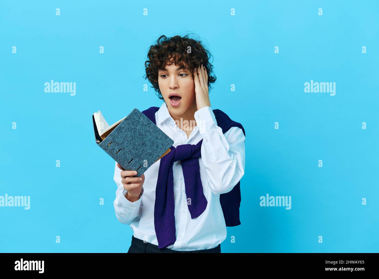 curly guy education with notepad hand gesture Lifestyle school Stock ...