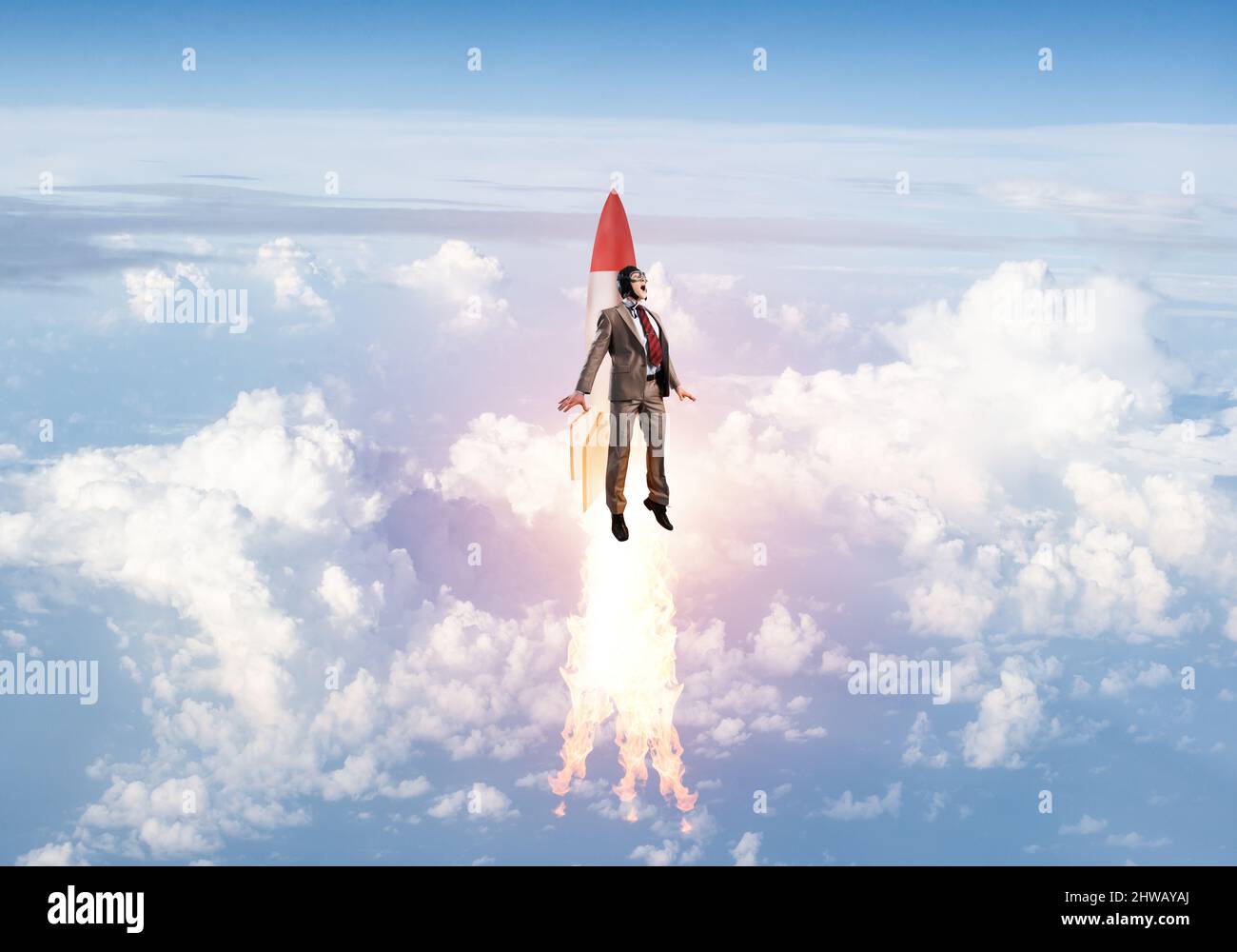 Business person in aviator hat flying on rocket Stock Photo - Alamy
