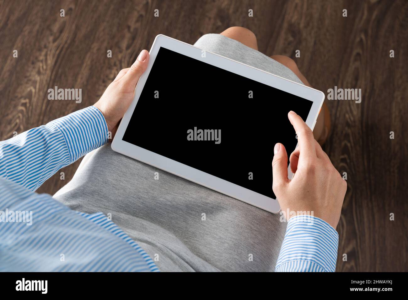 business woman with tablet on her lap Stock Photo - Alamy