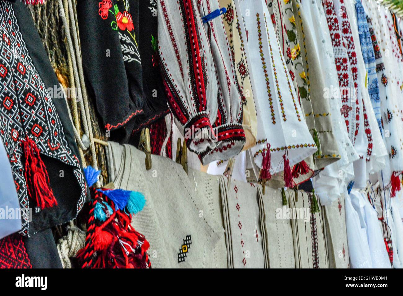 Number of colorful traditional costumes and clothes in a flea market in ...