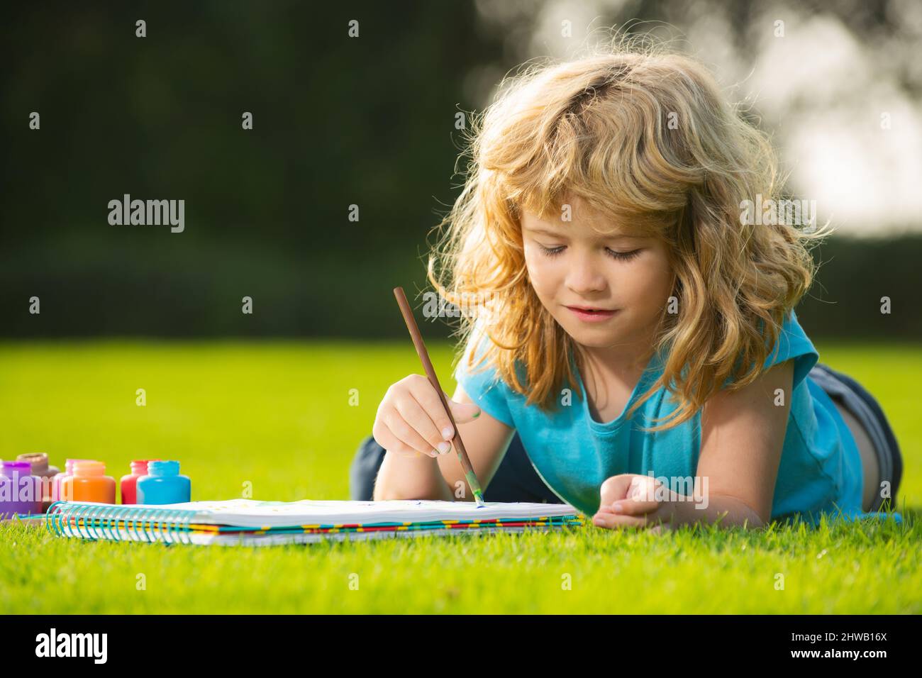 Young talented boy artist painter. Portrait of smiling happy kid ...