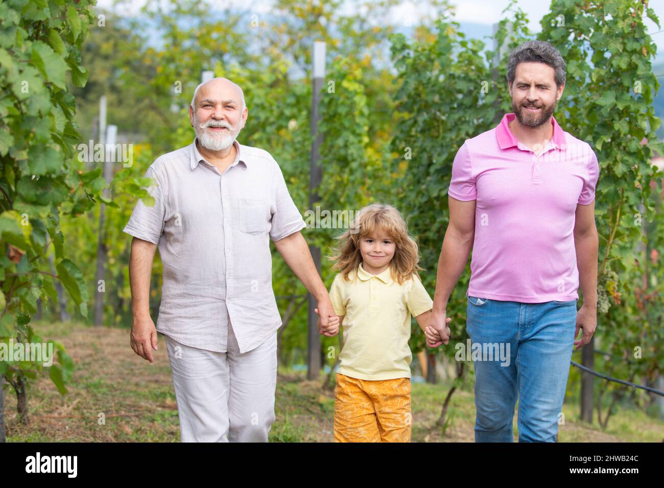 Male generation family walking together with three different ...