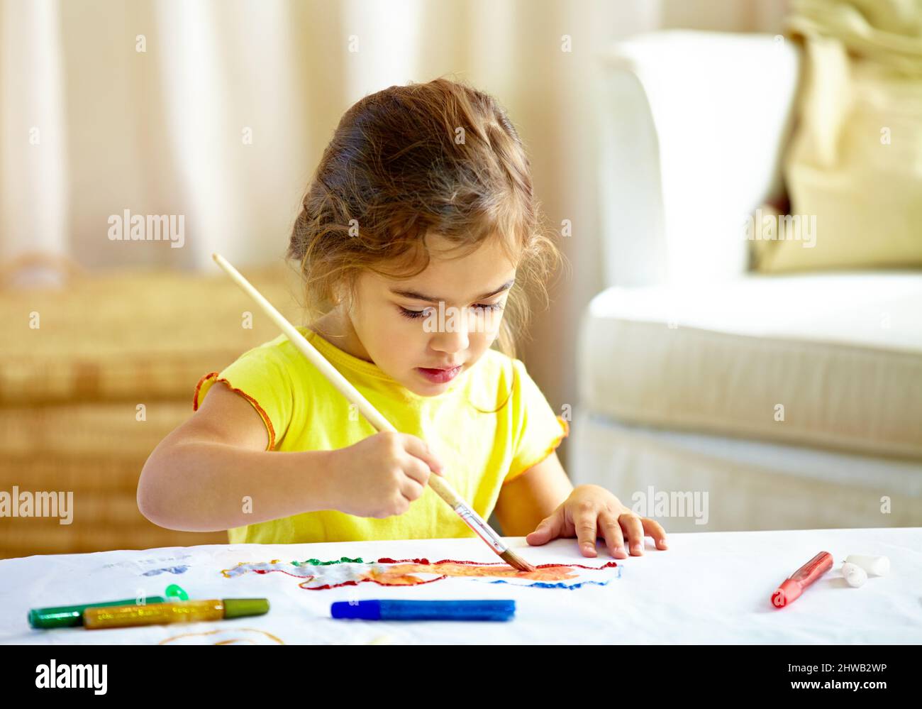 Every child is an artist. Shot of an adorable little girl making a mess ...