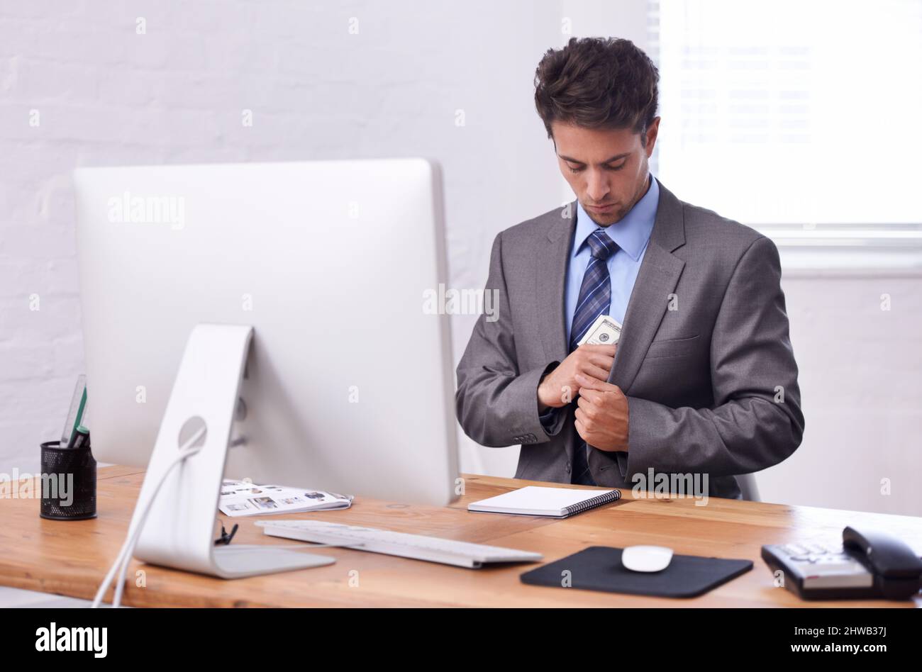 Pocketing cash hi-res stock photography and images - Alamy