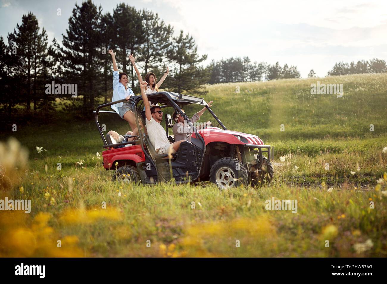 group of young happy friend driving a off road buggy car Stock Photo ...