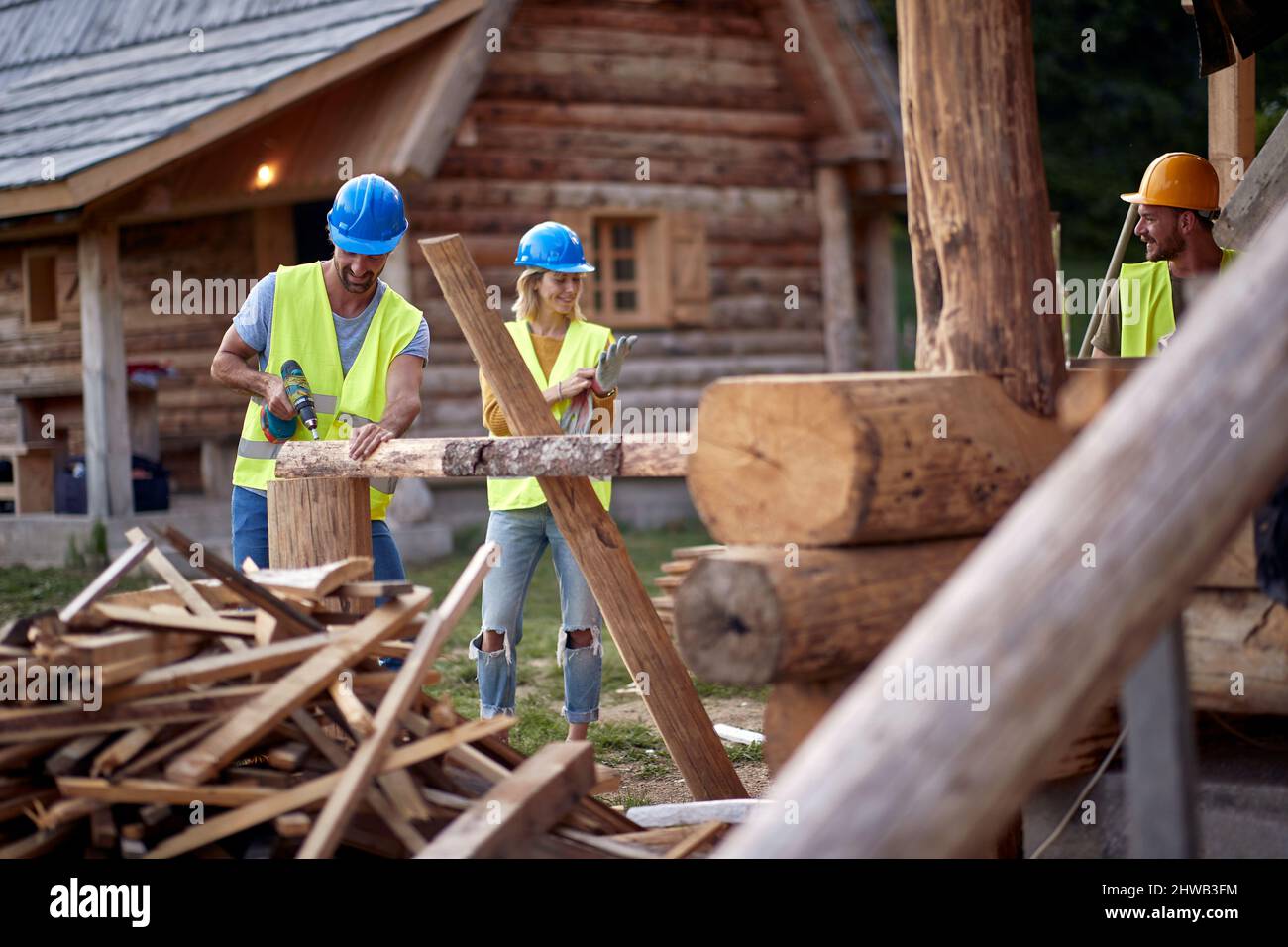 Supervisor interacting with male workers. Young cheerful construction ...