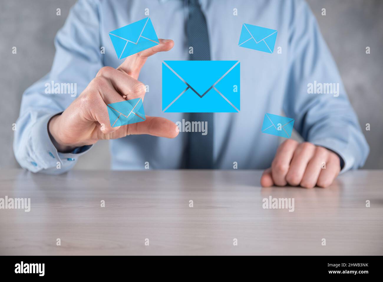 Businessman hand holding e-mail icon, Contact us by newsletter email ...