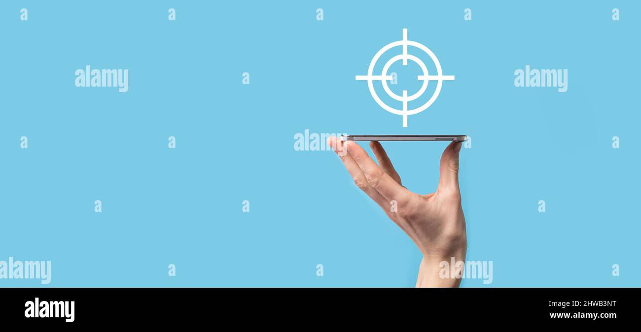 Targeting concept with hand holding target icon dartboard sketch on ...