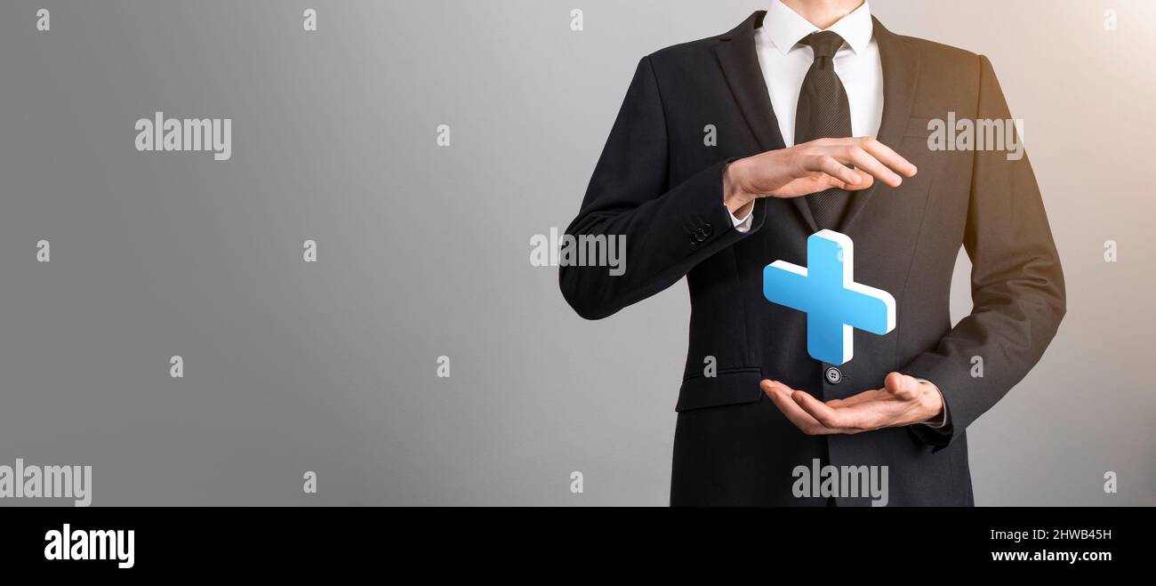 Businessman hold 3D plus icon, man hold in hand offer positive thing ...
