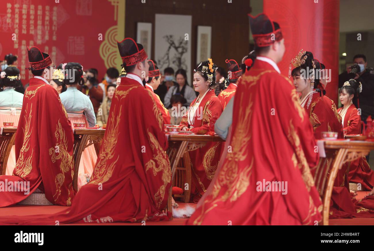 GUIYANG, CHINA - MARCH 5, 2022 - Twenty couples wearing traditional Han ...