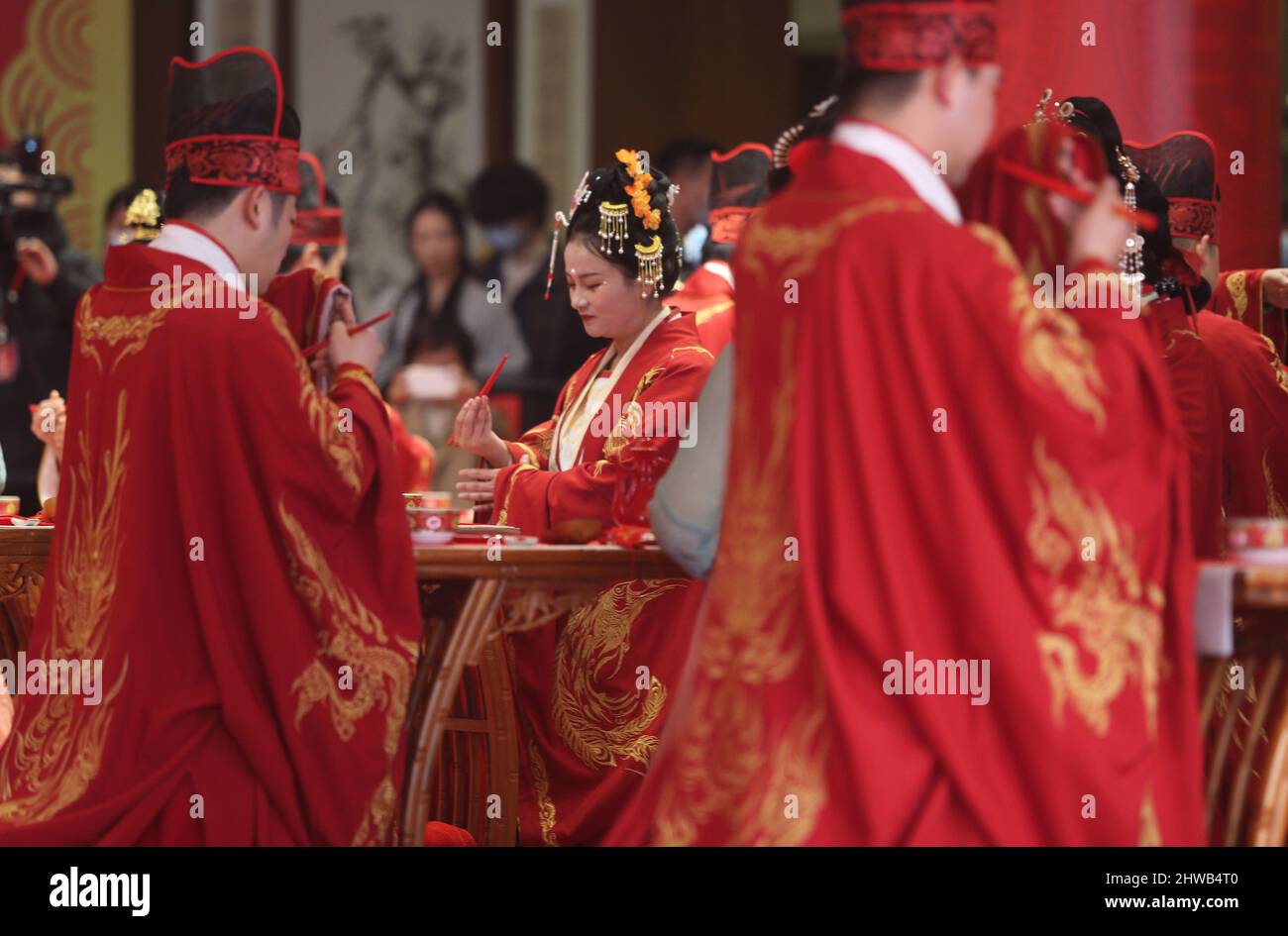 GUIYANG, CHINA - MARCH 5, 2022 - Twenty couples wearing traditional Han ...