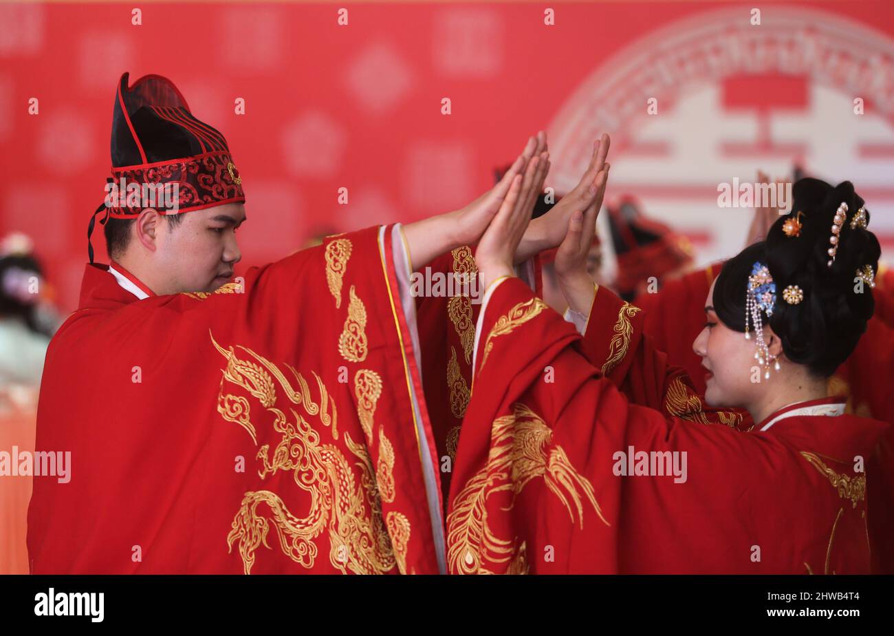GUIYANG, CHINA - MARCH 5, 2022 - Twenty couples wearing traditional Han ...