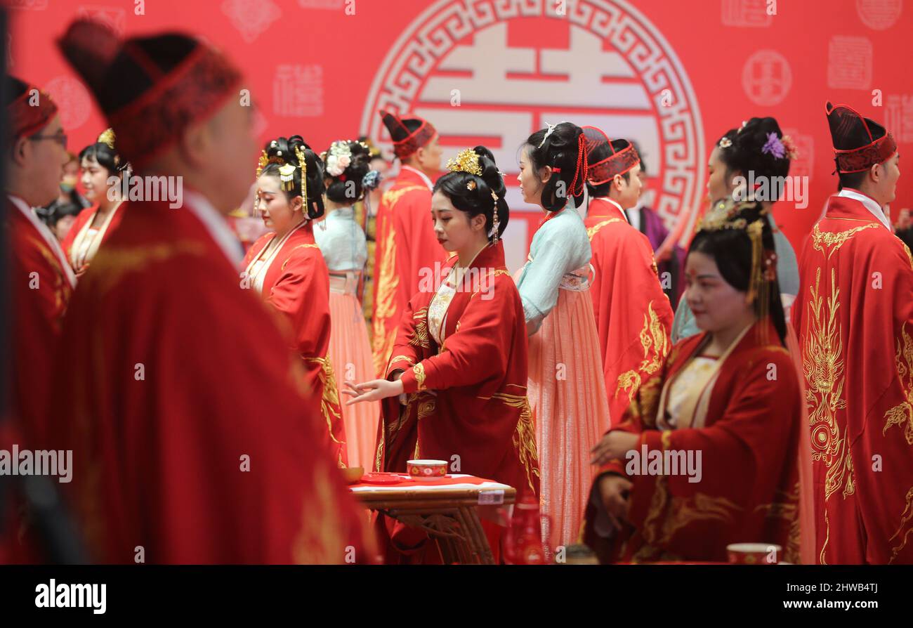 GUIYANG, CHINA - MARCH 5, 2022 - Twenty couples wearing traditional Han ...