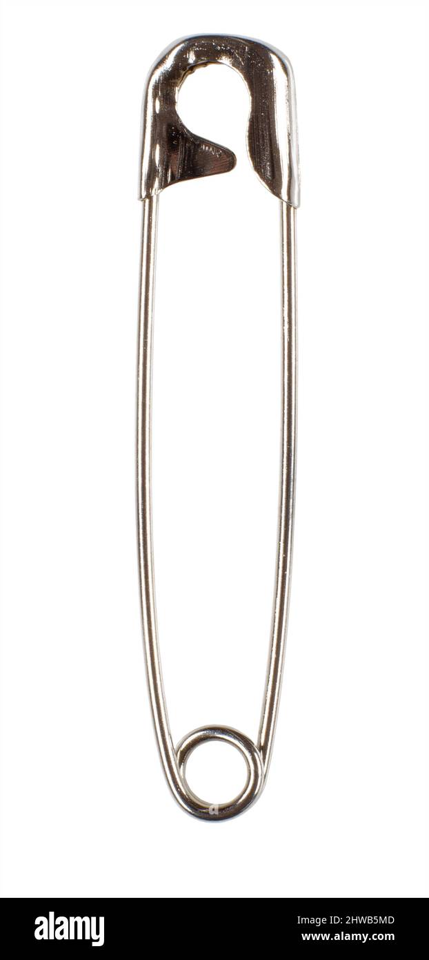 single safety pin on white background Stock Photo - Alamy