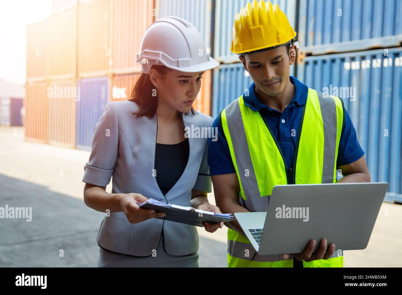 product inspection department working and check on laptop for stock in ...