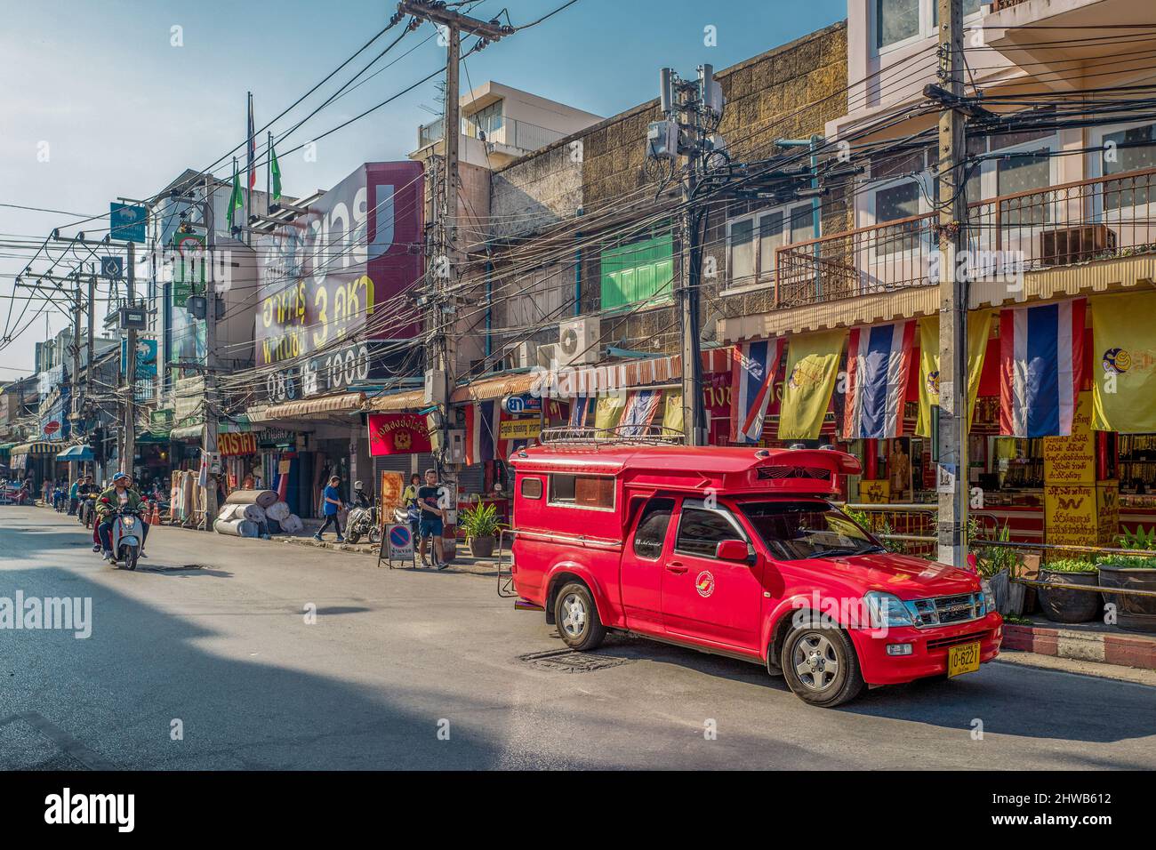 Traditional red songthaew in Chiang Mai. This ancient town is a popular ...