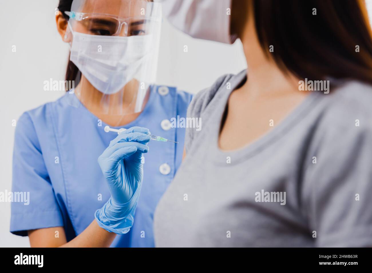 Asian woman doctor holding syringe and using cotton before make ...