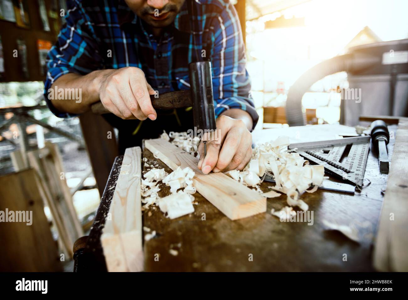 carpenter worker working and repair furniture Stock Photo - Alamy