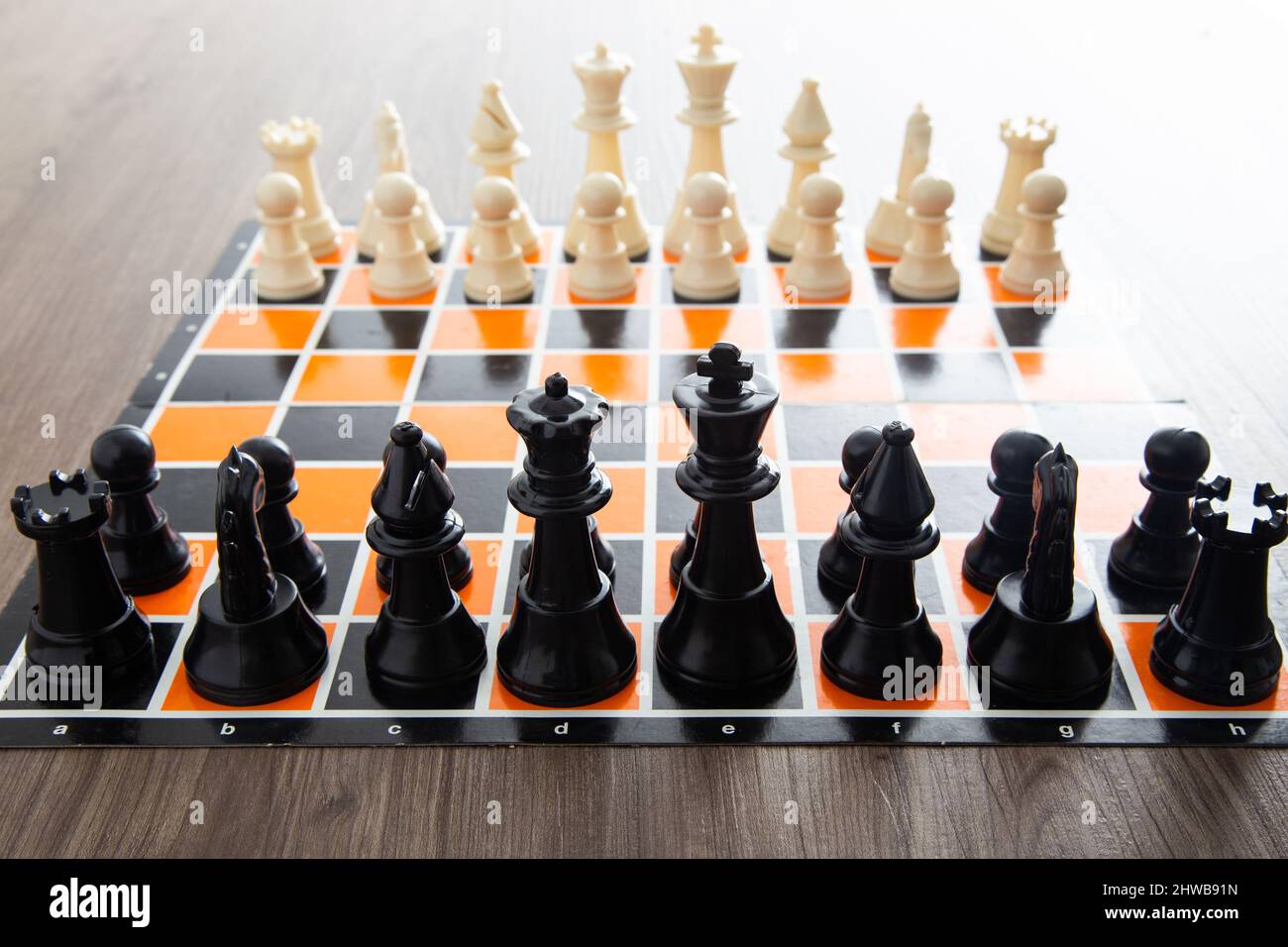 Chess board game on wooden background Stock Photo - Alamy