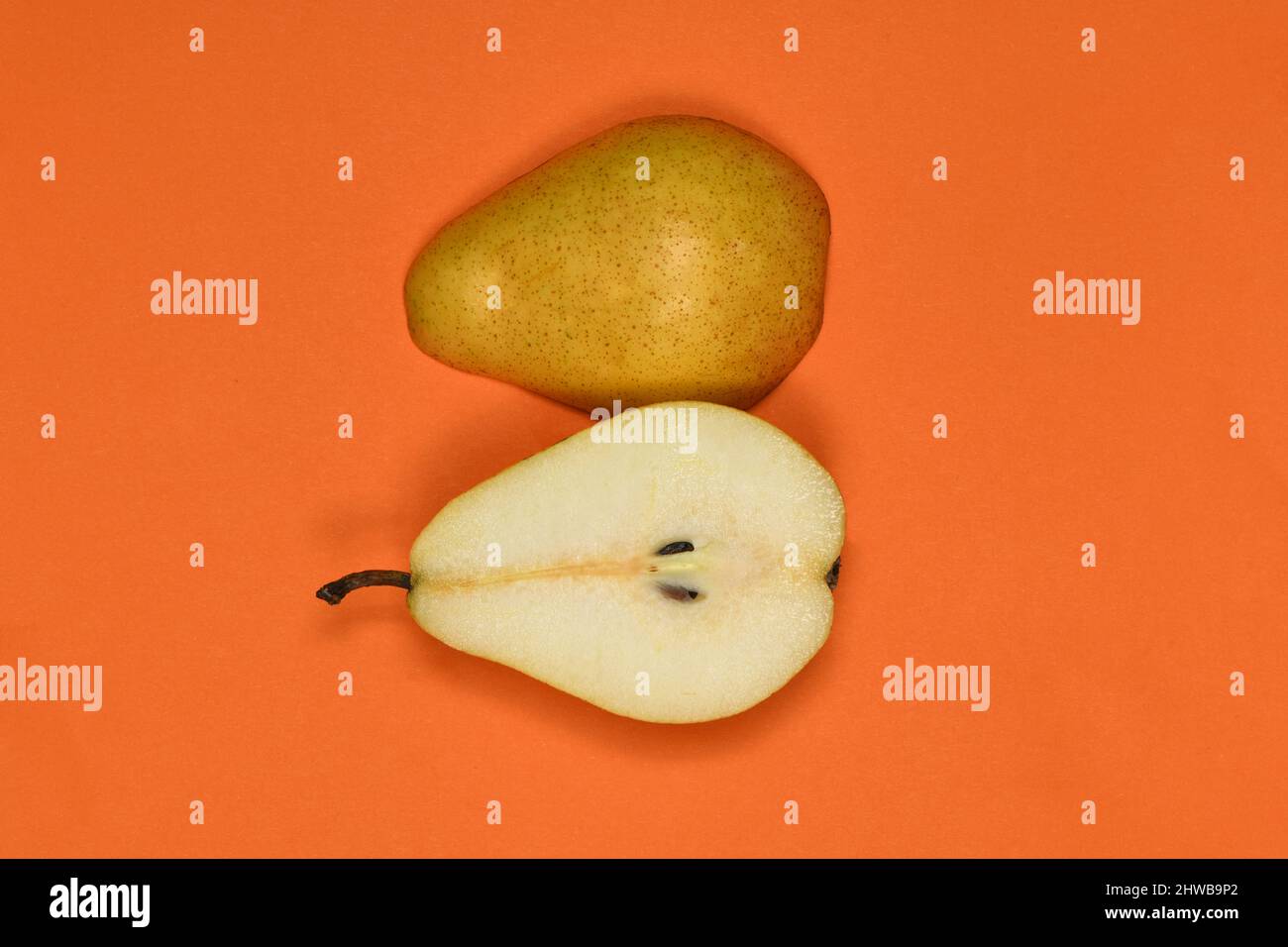 Pears isolated on orange background. Pears macro studio photo. High ...