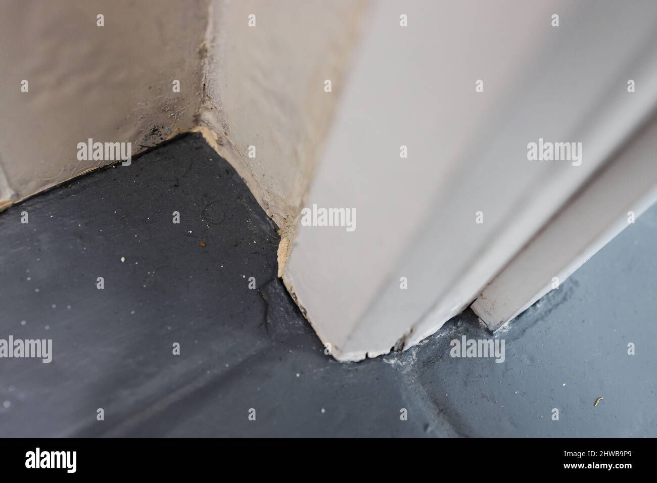 close up of tile flooring and architrave with old worn out materials in ...