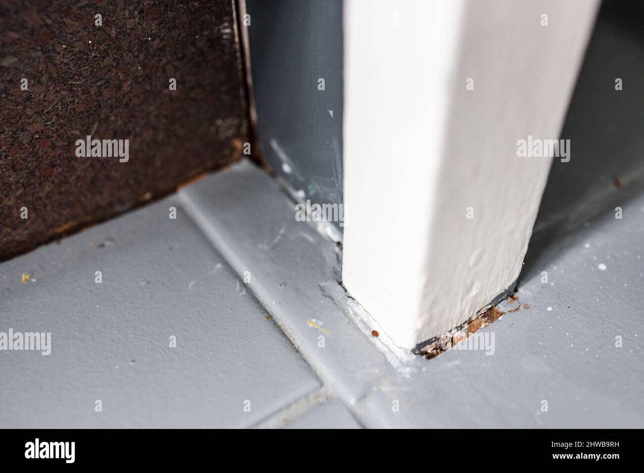 close up of tile flooring and architrave with old worn out materials in ...