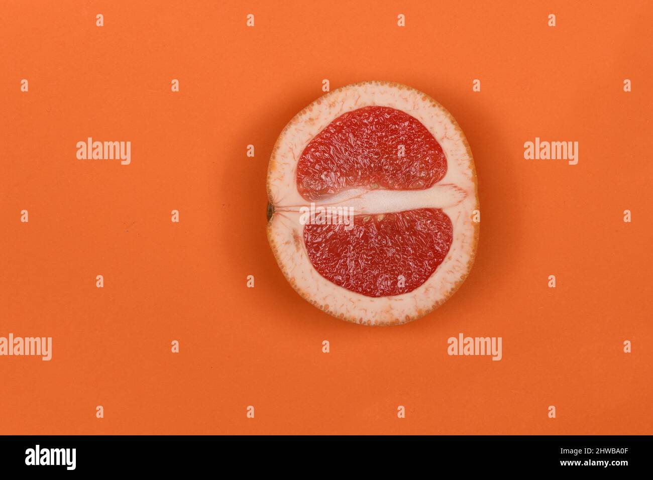 Grapefruit isolated on orange background. High resolution photo. Full ...